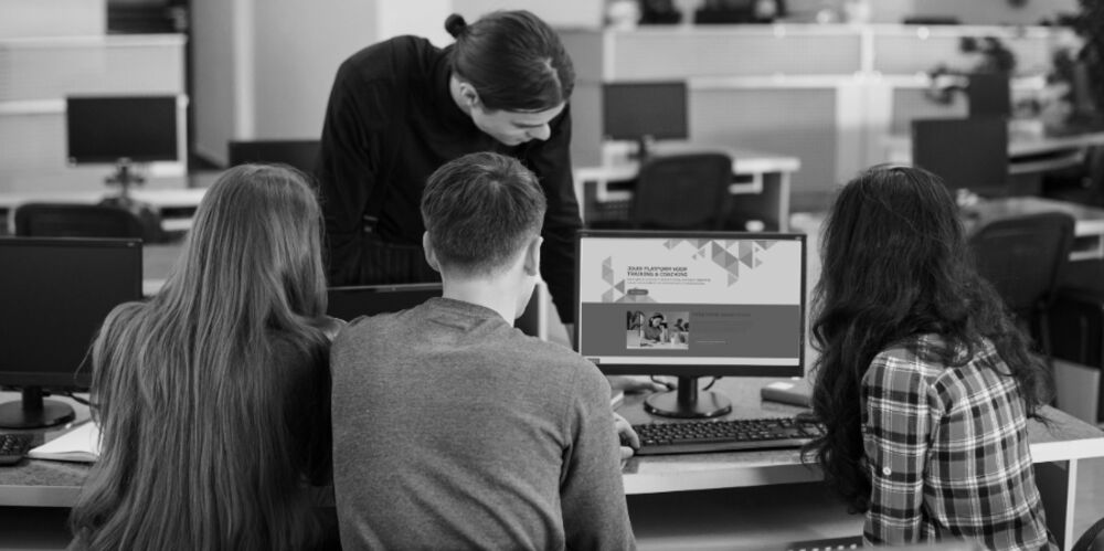 people looking at laptop @ LearningStone